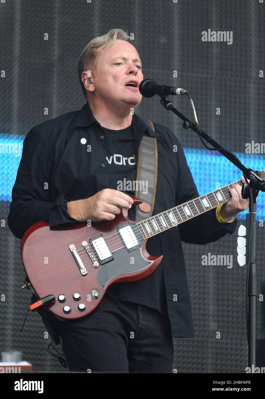 Bernard Sumner of New Order performs on stage for the at the BT London ...