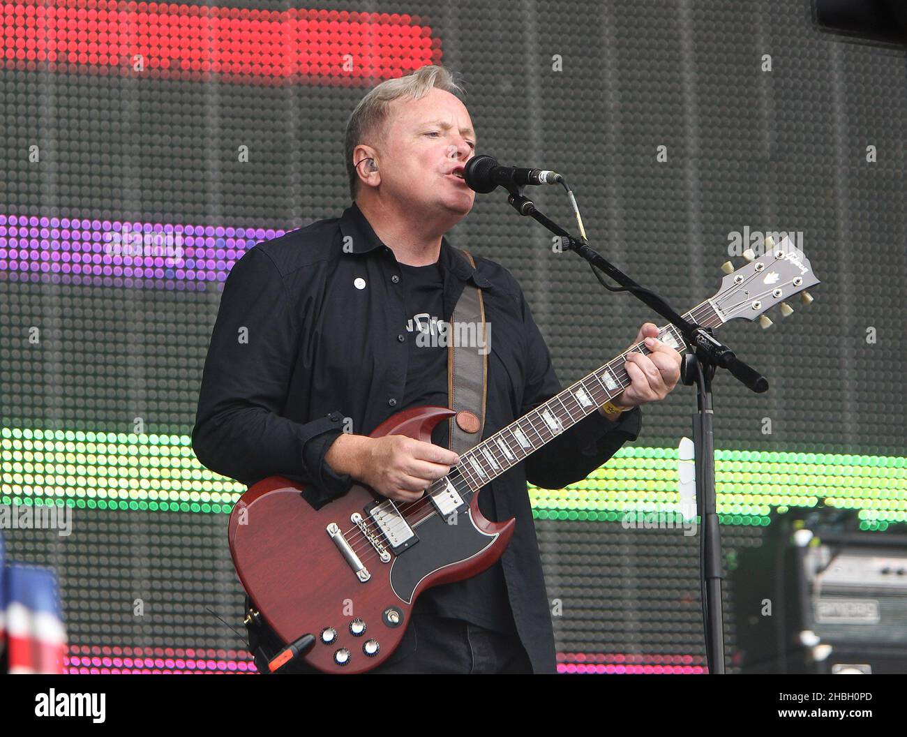 Bernard Sumner of New Order performs on stage for the at the BT London ...