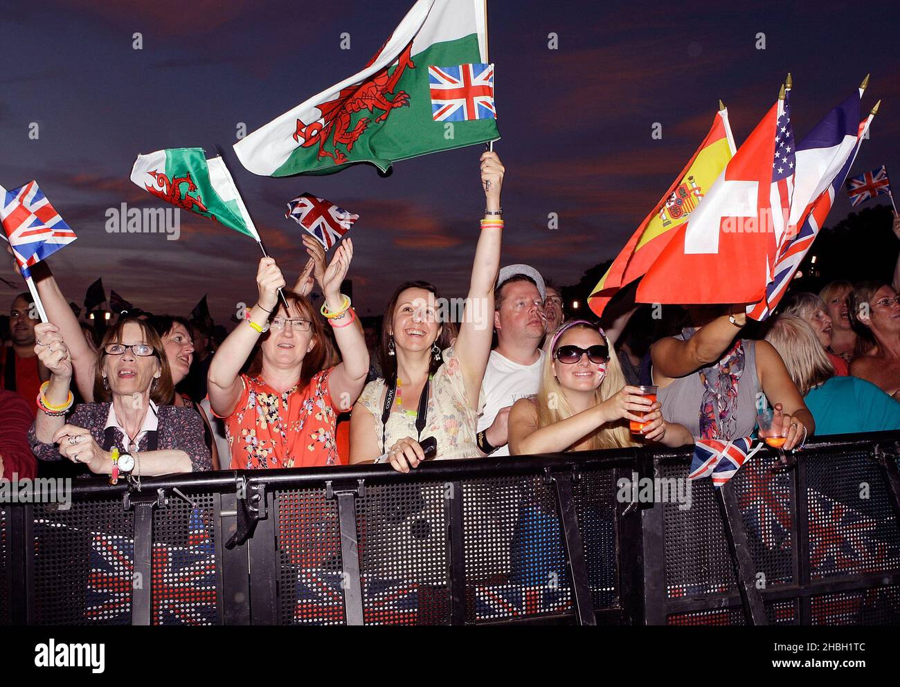 Crowd fans watching at waving flags at bbc proms hi-res stock ...