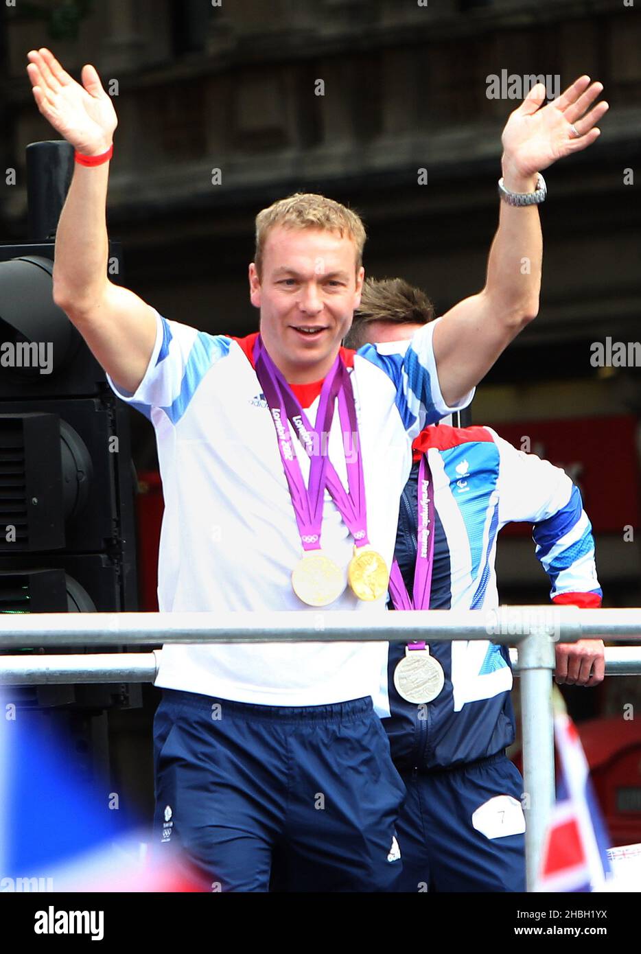 Chris Hoy, cycling gold medalist, waves as the parade celebrating ...