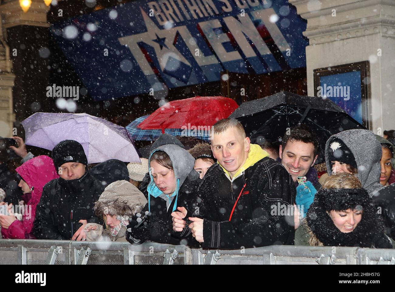Fans in the crowd brave the January snow to greet the shows judges ...