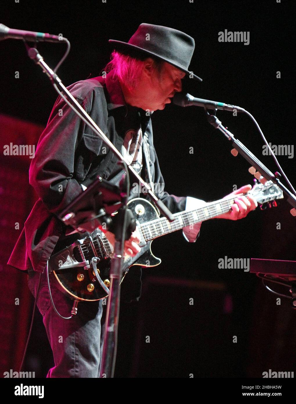 Neil Young performs on stage at the 02 Arena in London Stock Photo - Alamy