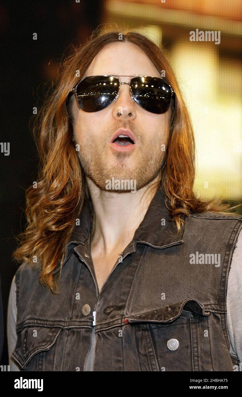 Jared Leto of Thirty Seconds to Mars signs copies of their new album ...