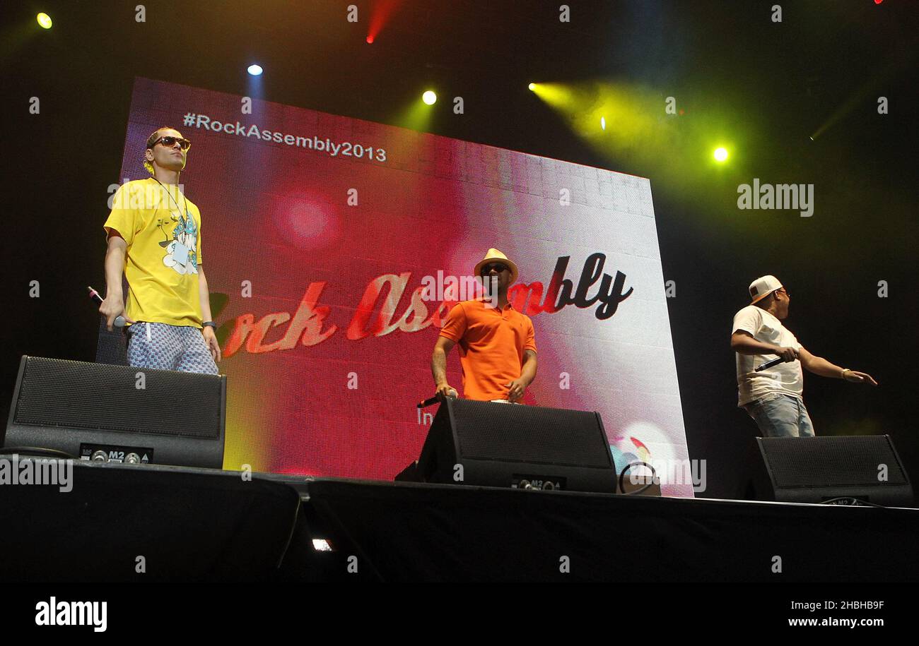 Scratchy (centre) and his band Roll Deep perform on stage at the Rock ...