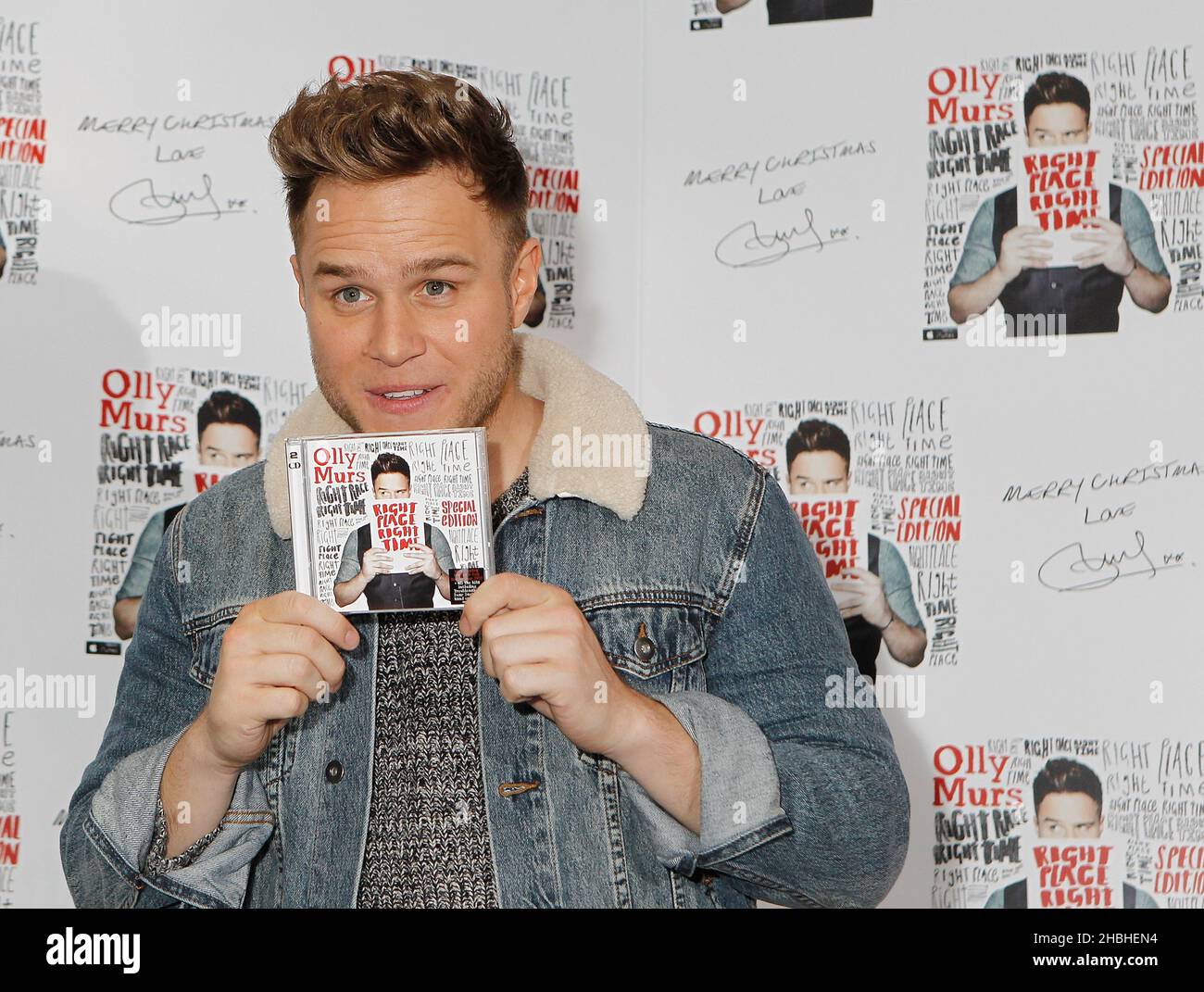 Olly Murs signs copies of his latest single, Hand On Heart, and album ...