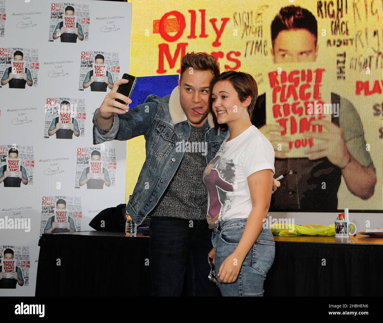 Olly Murs signs copies of his latest single, Hand On Heart, and album ...