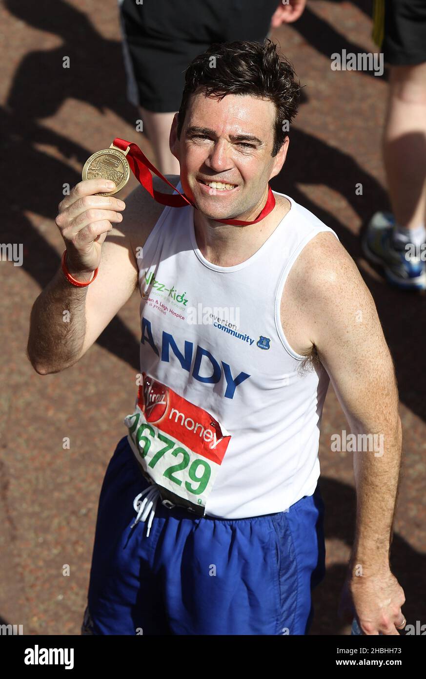 Andy Burnham MP with medal at the finishing line of the Virgin Money ...