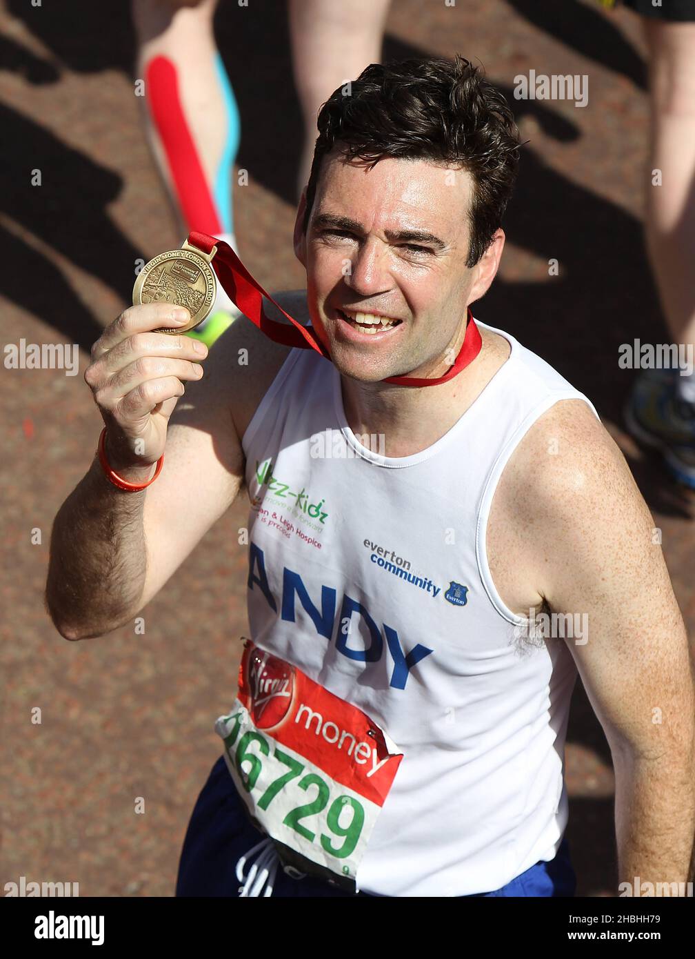 Andy Burnham MP with medal at the finishing line of the Virgin Money ...