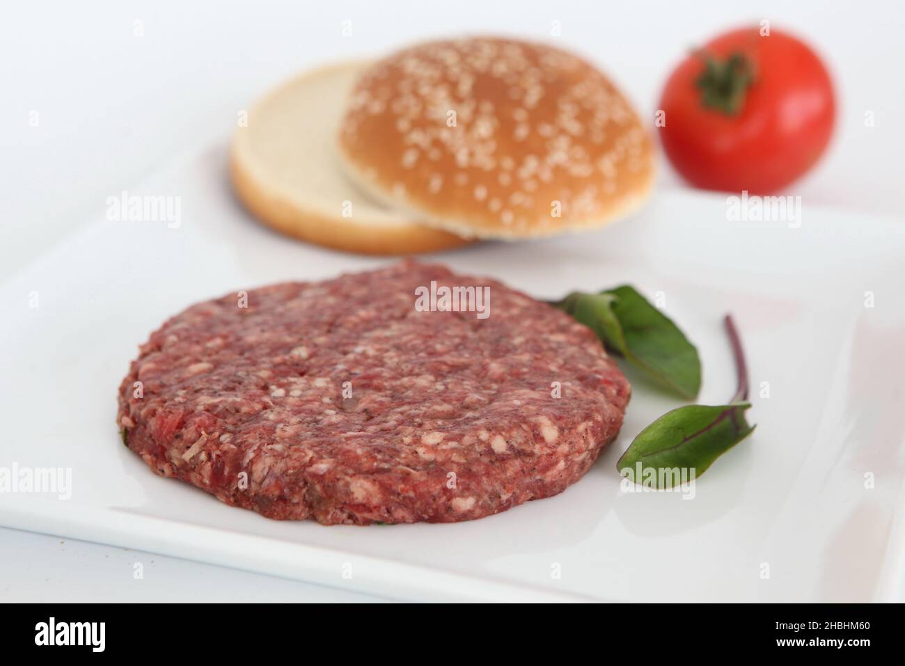 Raw hamburger patty Stock Photo - Alamy