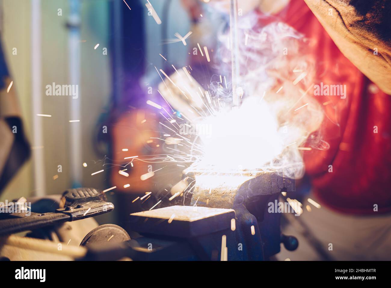 Man hand Industrial worker welding metal at factory workshop at Steel ...