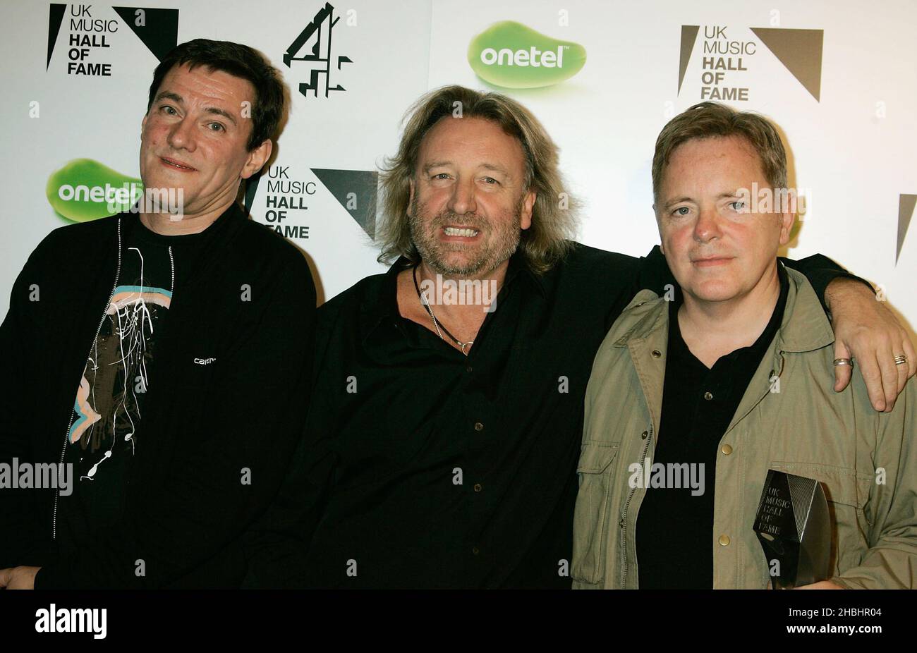 New Order poses in press room with award and at the Hall of Fame Awards ...