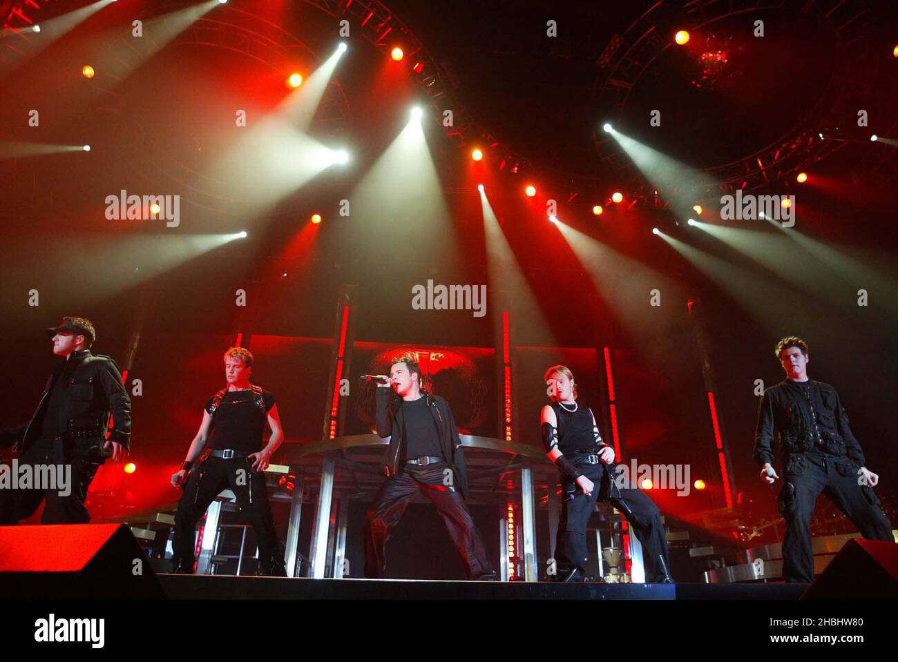 Westlife perform live at the London Arena. Full length Stock Photo - Alamy