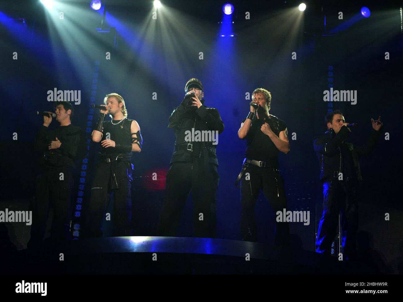 Westlife perform live at the London Arena. Full length Stock Photo - Alamy