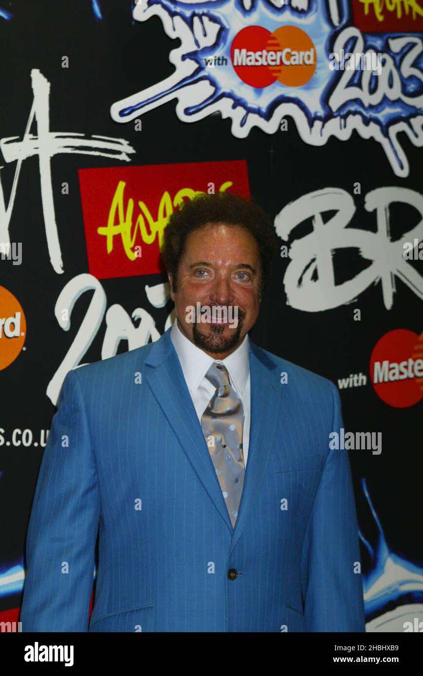 Tom Jones photographed at the 2003 Brit Awards in London. 3/4 length ...
