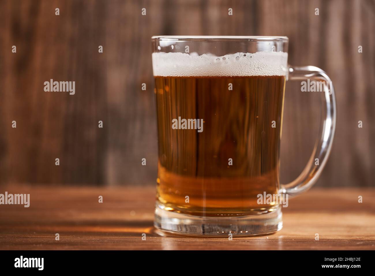 Blonde beer in a mug with frosty top on rustic wooden background Stock ...