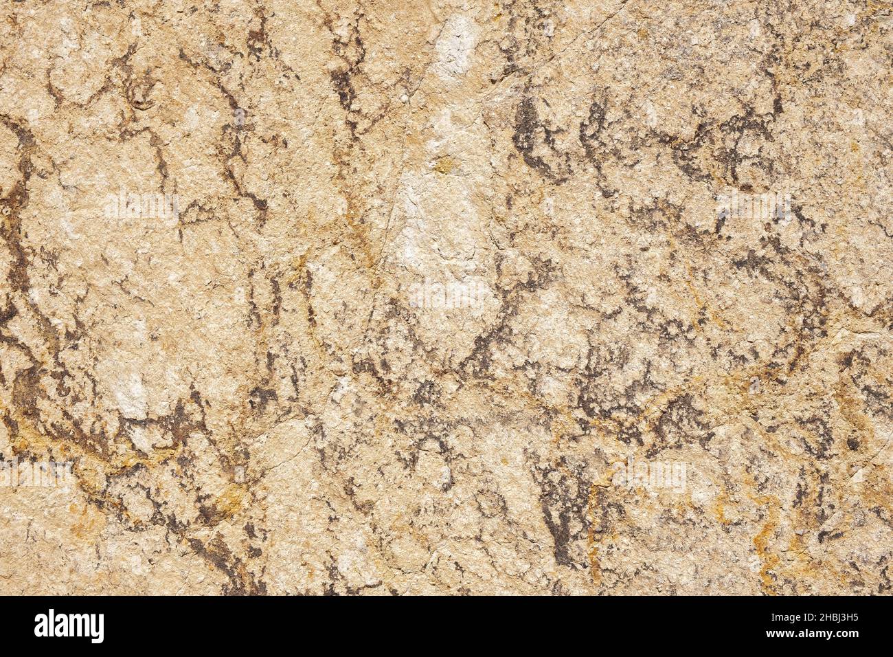 Old light brown wall covered with shabby uneven plaster. Texture of ...