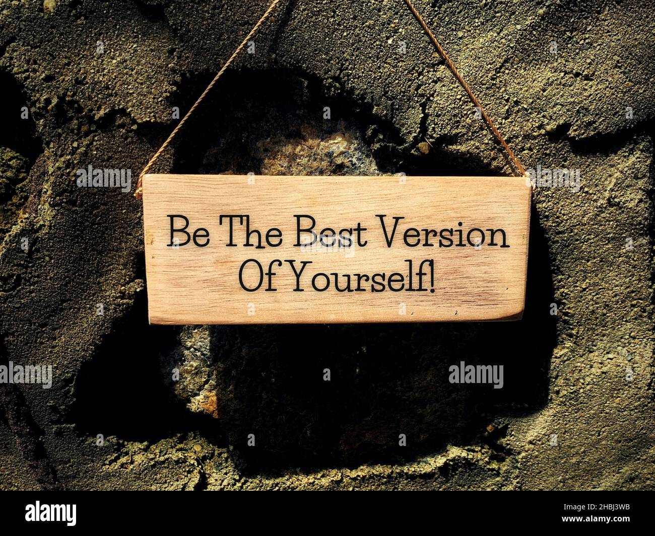 Inspirational quotes on a wooden signage with rock background - Be The ...