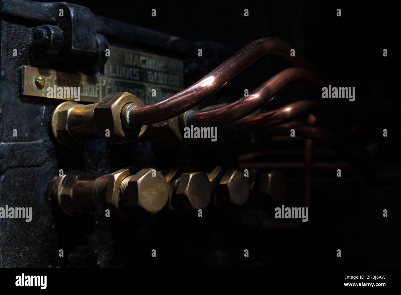 closeup of copper tubes of a steam train at the Dutch Railway Museum ...