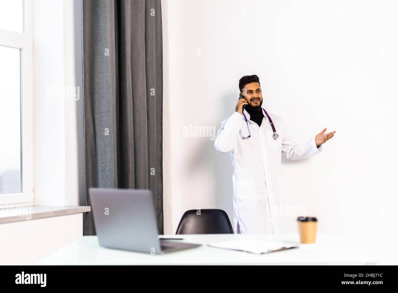 View of a young doctor phoning a patient Stock Photo - Alamy