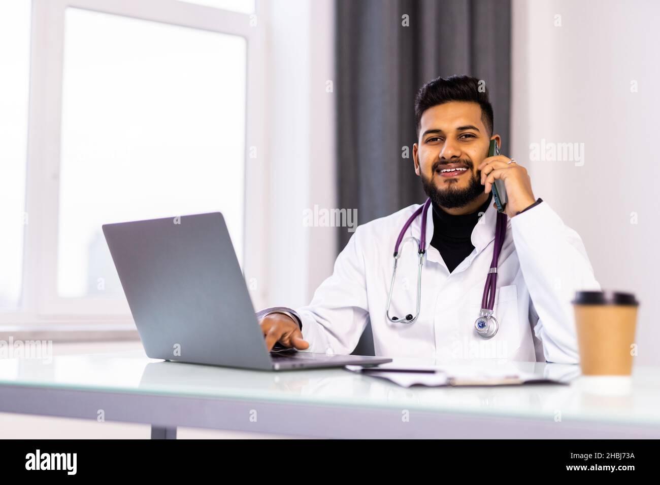View of a young doctor phoning a patient Stock Photo - Alamy