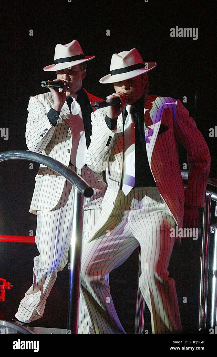 Westlife quartet less Brian McFadden perform on stage promoting their ...