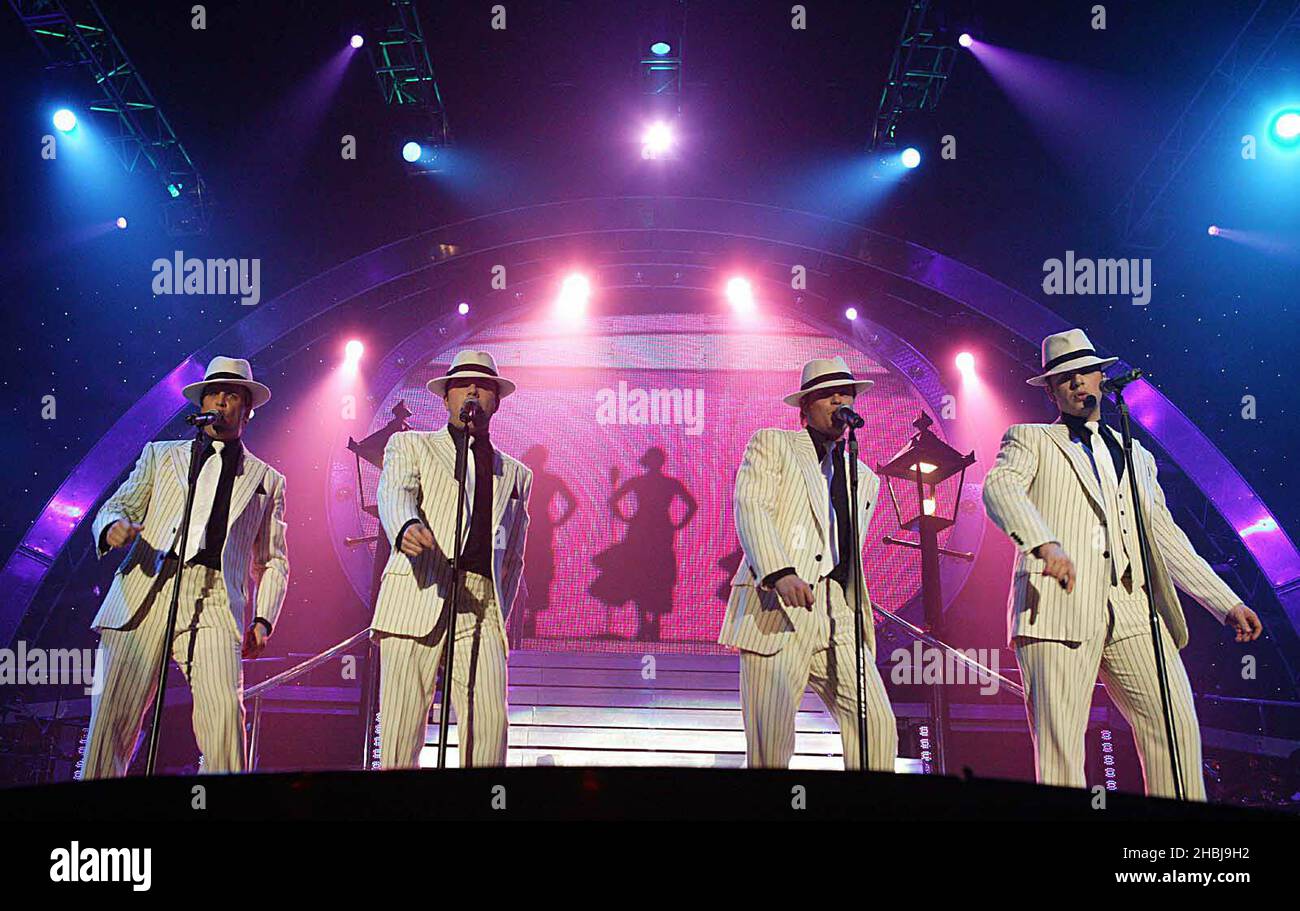 Westlife quartet less Brian McFadden perform on stage promoting their ...