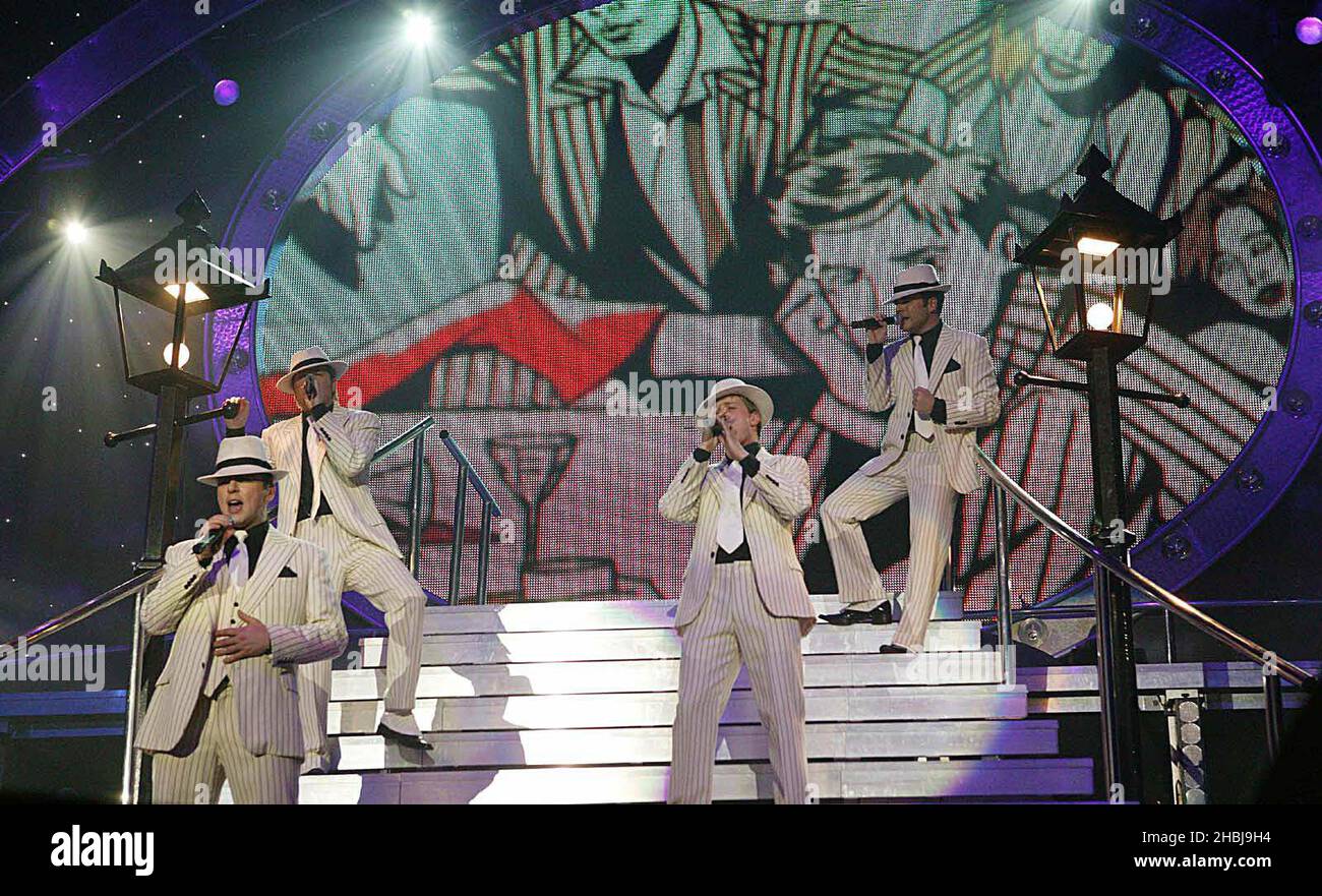 Westlife quartet less Brian McFadden perform on stage promoting their ...