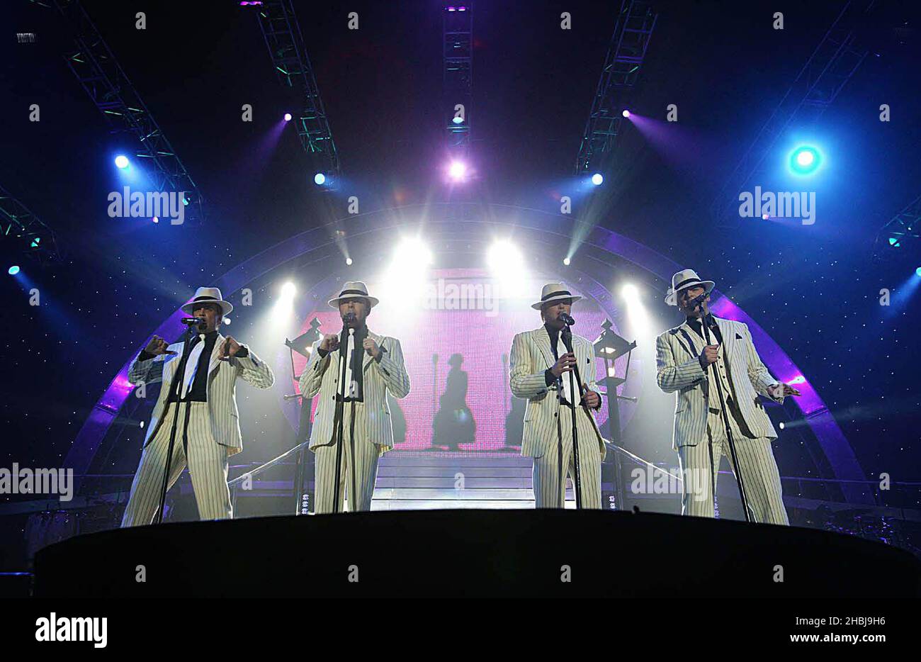 Westlife quartet less Brian McFadden perform on stage promoting their ...