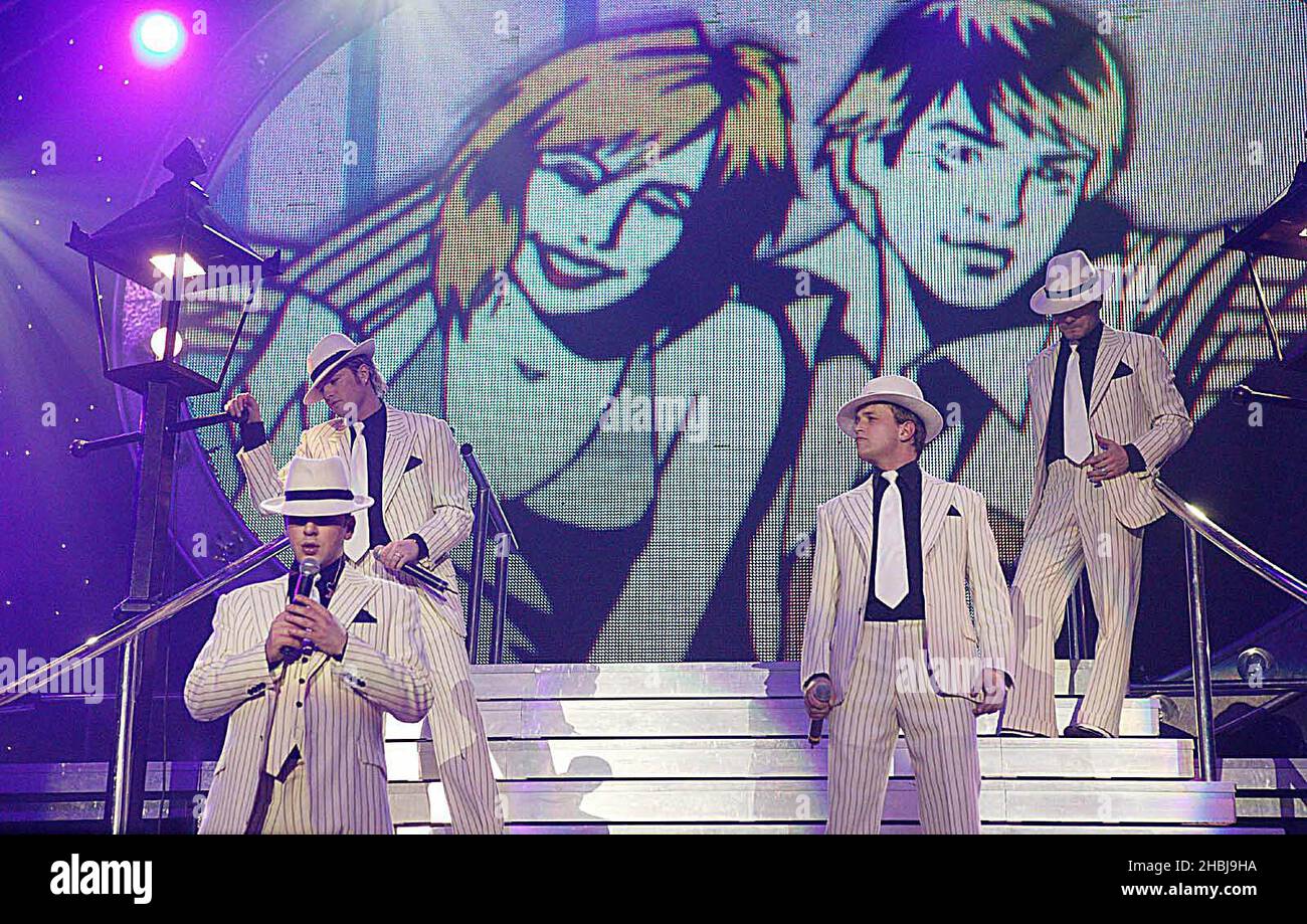 Westlife quartet less Brian McFadden perform on stage promoting their ...