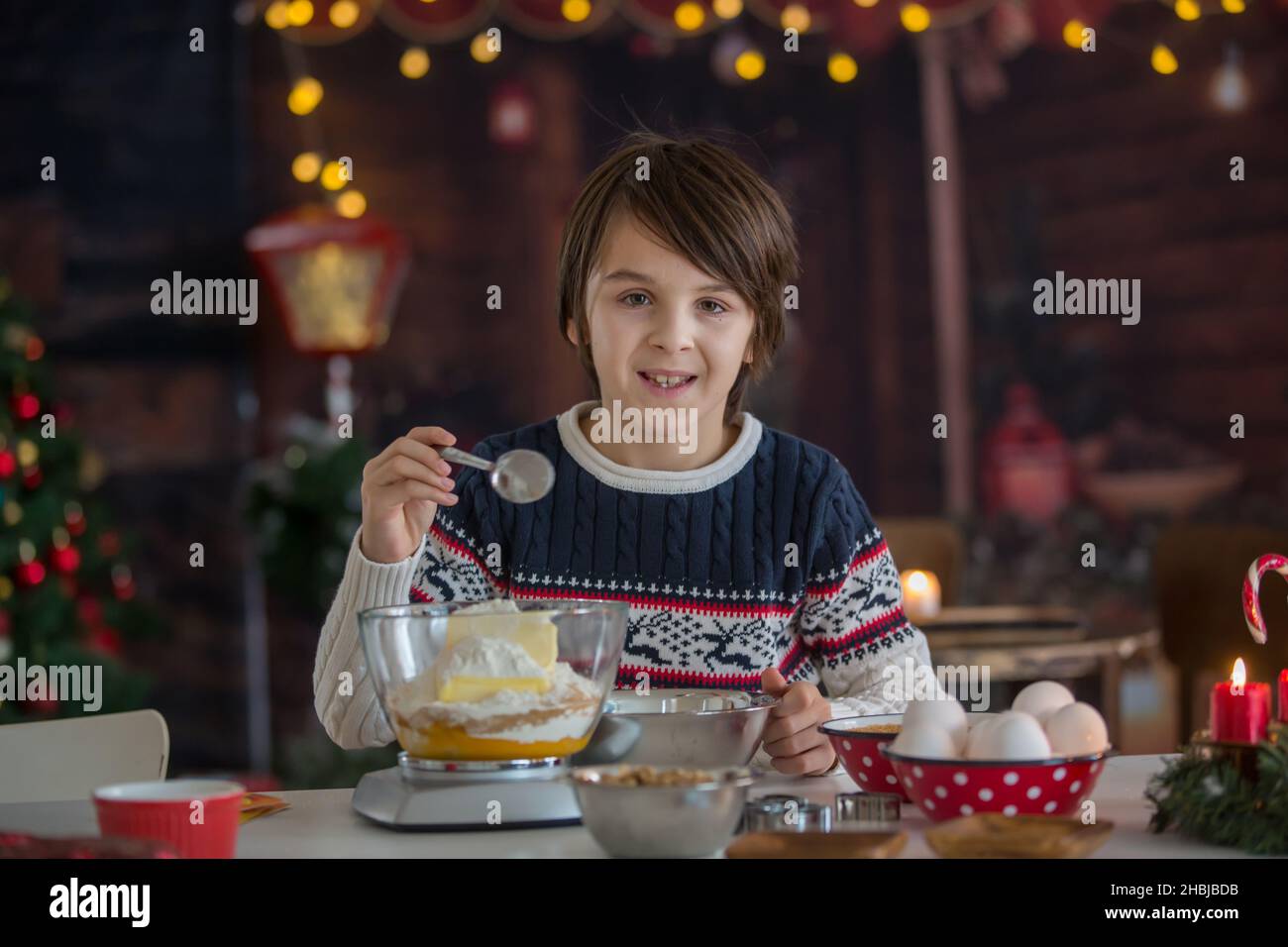 Preteen child, preparing his first cookies, made alone, baking ...