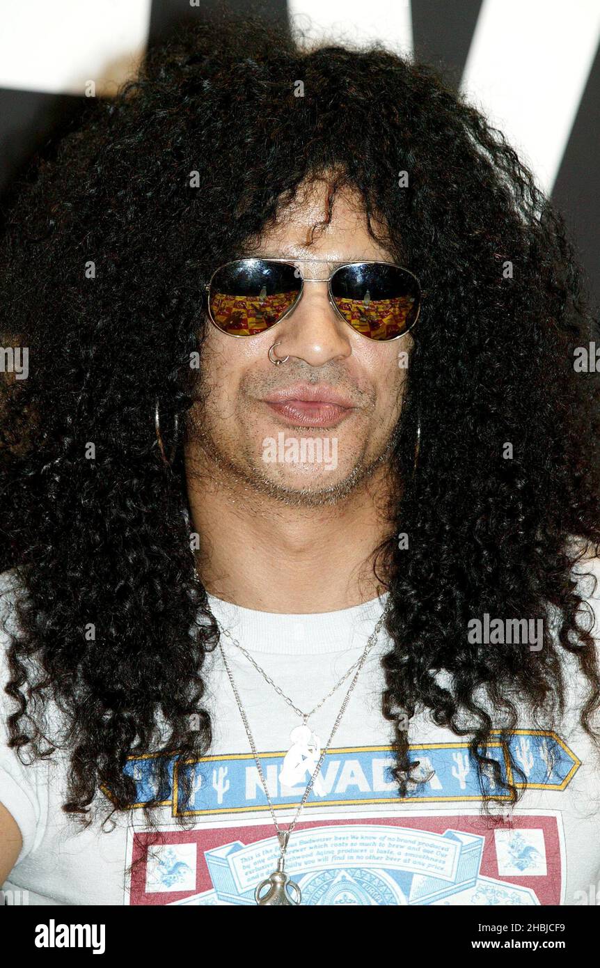Slash from Velvet Revolver signs copies of their first album Contraband ...