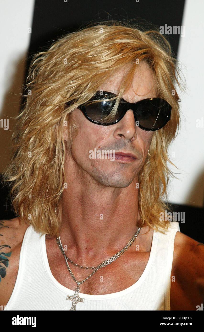 Duff McKagan from Velvet Revolver signs copies of their first album ...