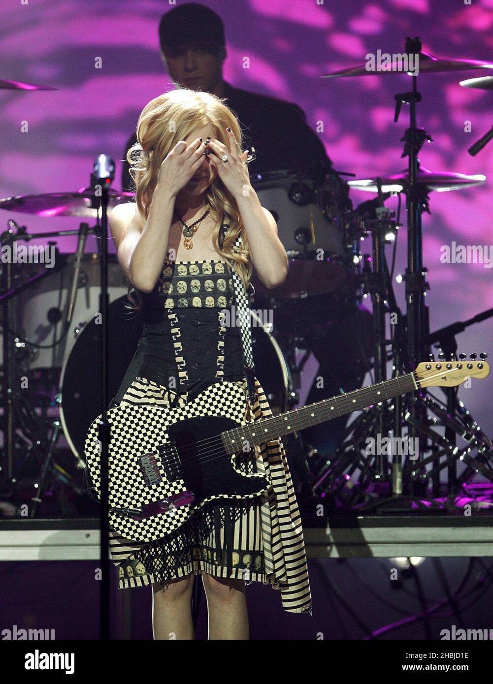 Avril Lavigne performs on stage at the 2004 World Music Awards at the ...