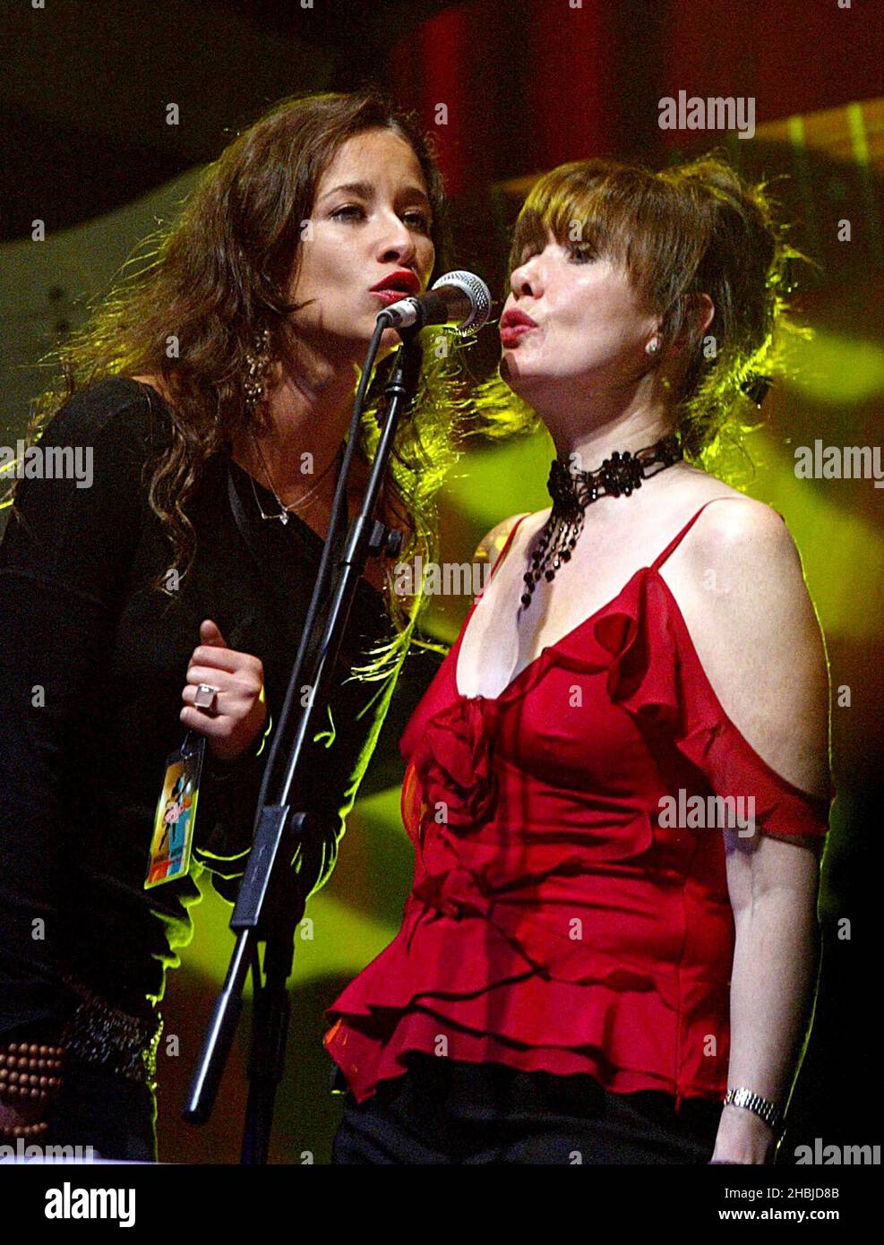 Leah Wood performs on stage as backing vocals with father Ronnie as ...