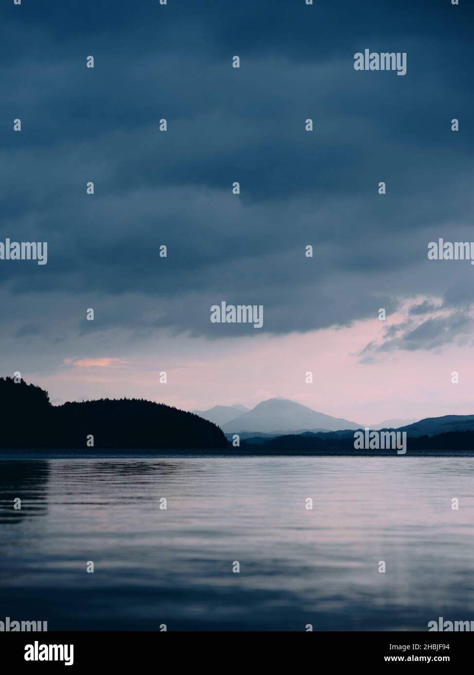Loch Garry minimal blue dusk still water Scottish loch landscape in the ...