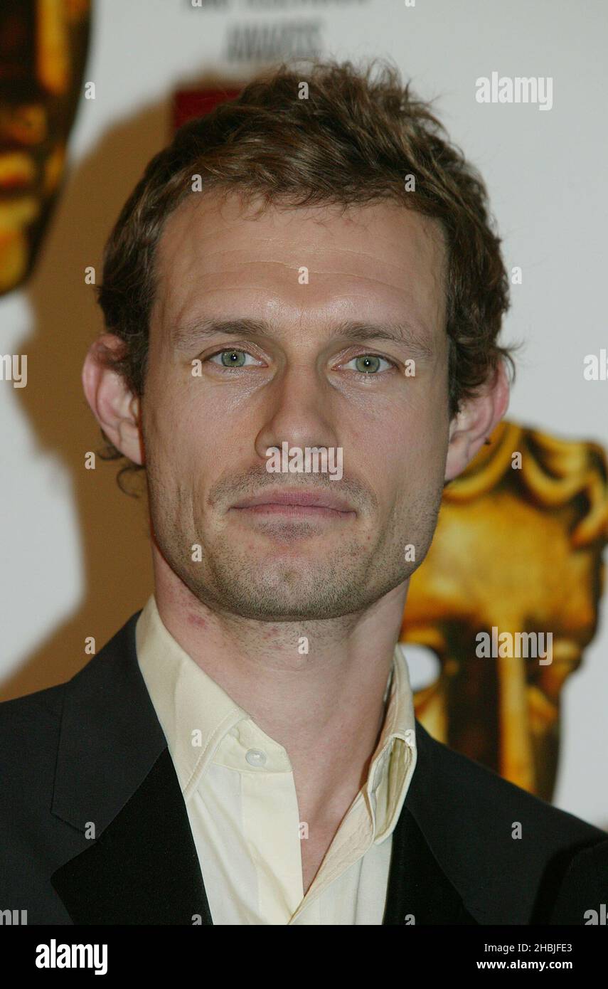 Ben Price poses at the boards in the press room at the "British Academy ...
