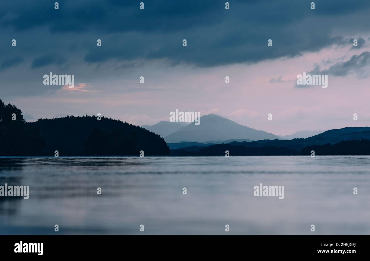 Loch Garry minimal blue dusk still water Scottish loch landscape in the ...