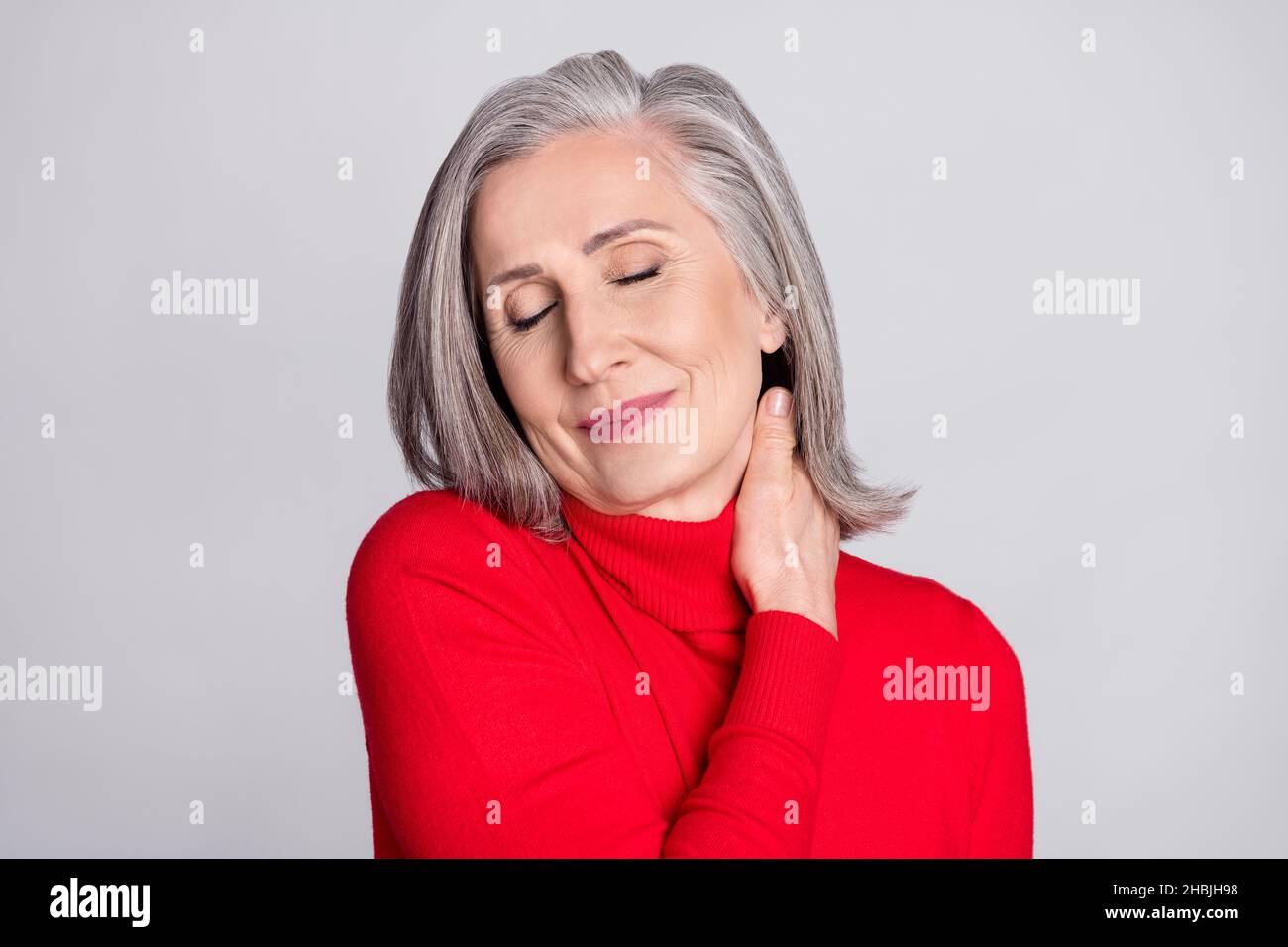 Photo of attractive aged woman happy positive smile hand touch neck ...