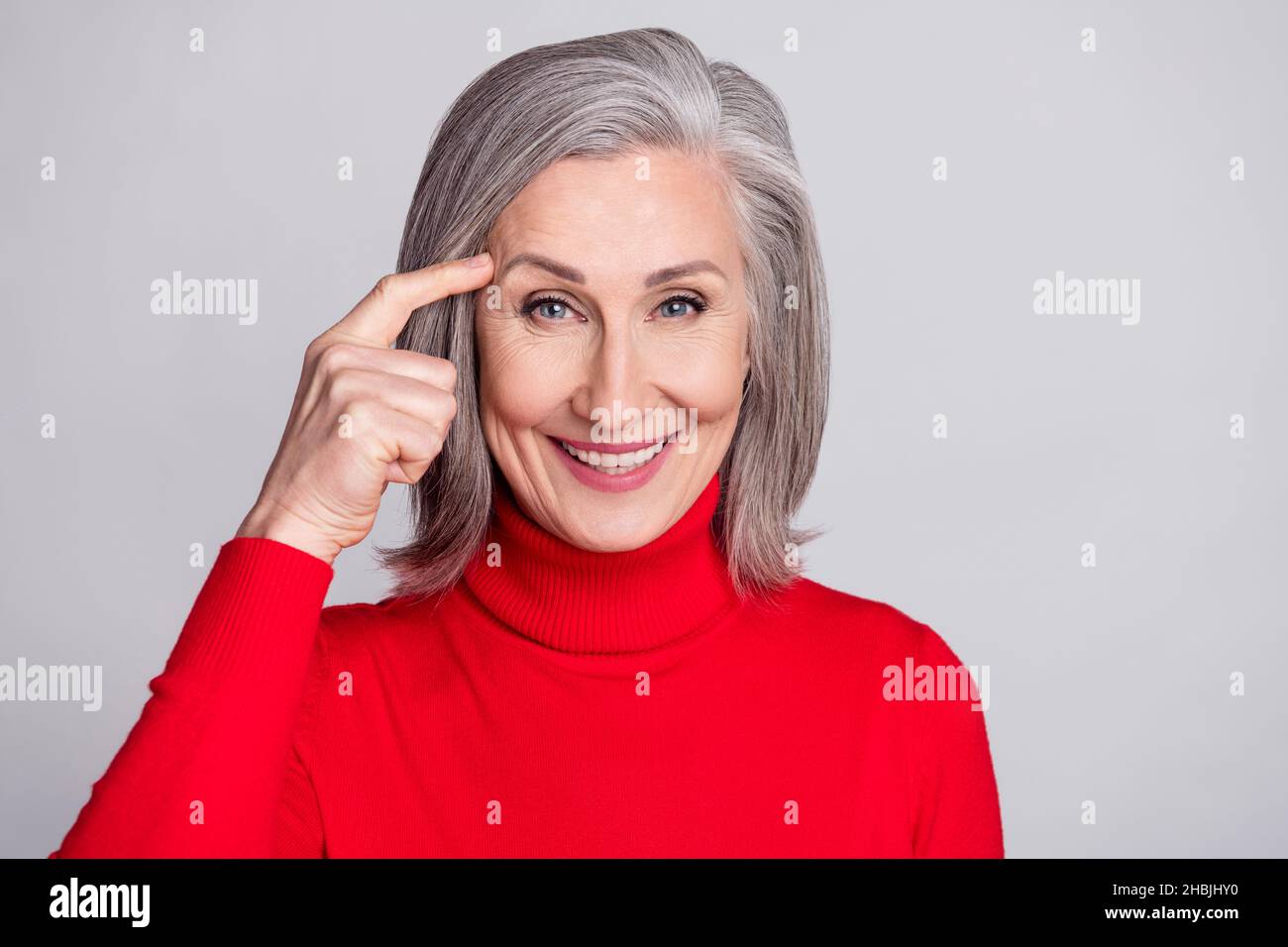 Photo of attractive aged woman happy positive smile finger touch head ...