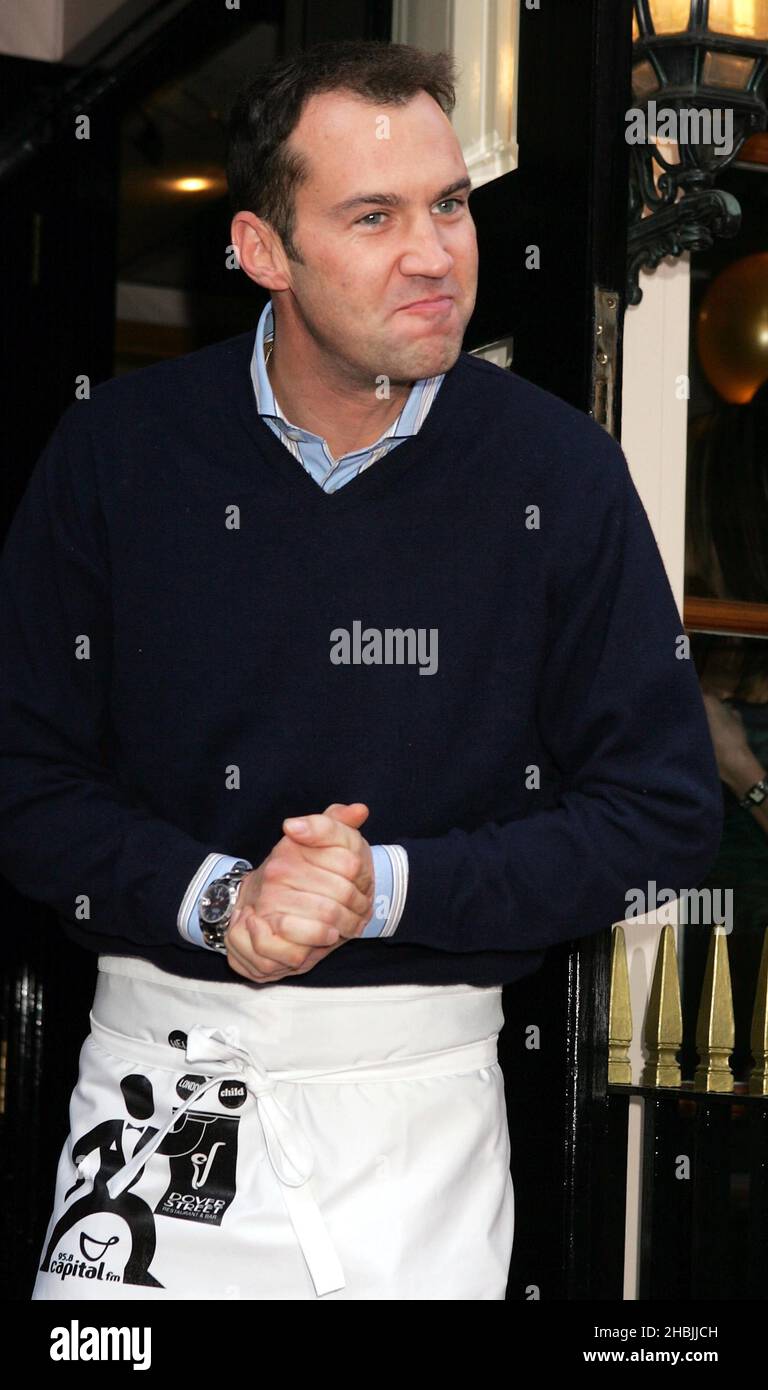 Johnny Vaughan as a waiter attends the Capital FM Help A London Child ...