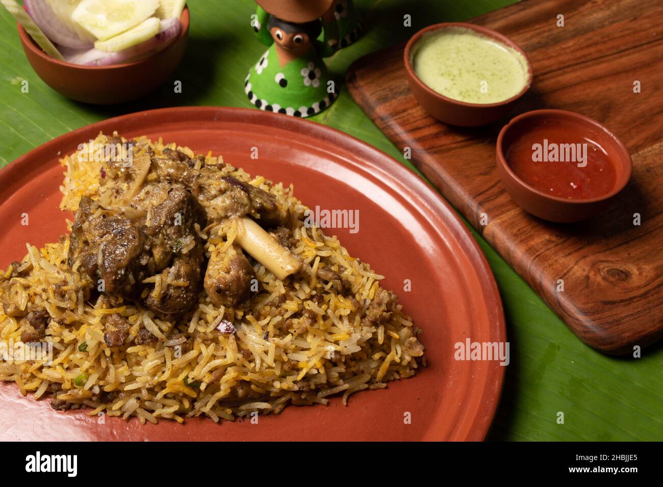 Shot of the spicy hot mutton biryani served in a brown plate Stock ...