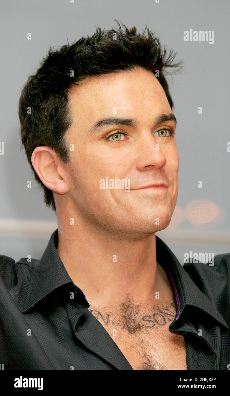 A new waxwork model of pop star Robbie Williams with and eye twinkle is ...