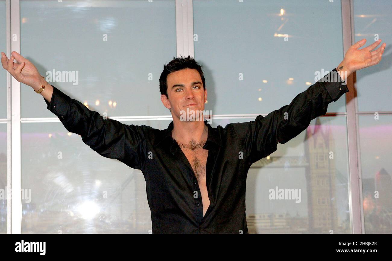 A new waxwork model of pop star Robbie Williams with and eye twinkle is ...