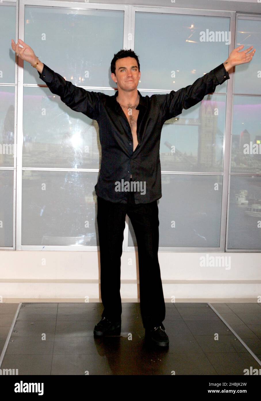 A new waxwork model of pop star Robbie Williams with and eye twinkle is ...