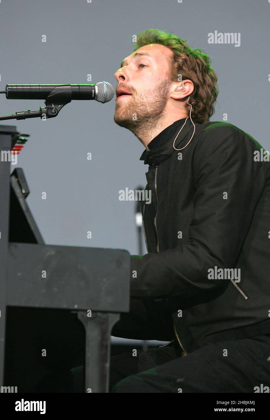 Chris Martin of Coldplay performs on stage as Coldplay perform on stage ...