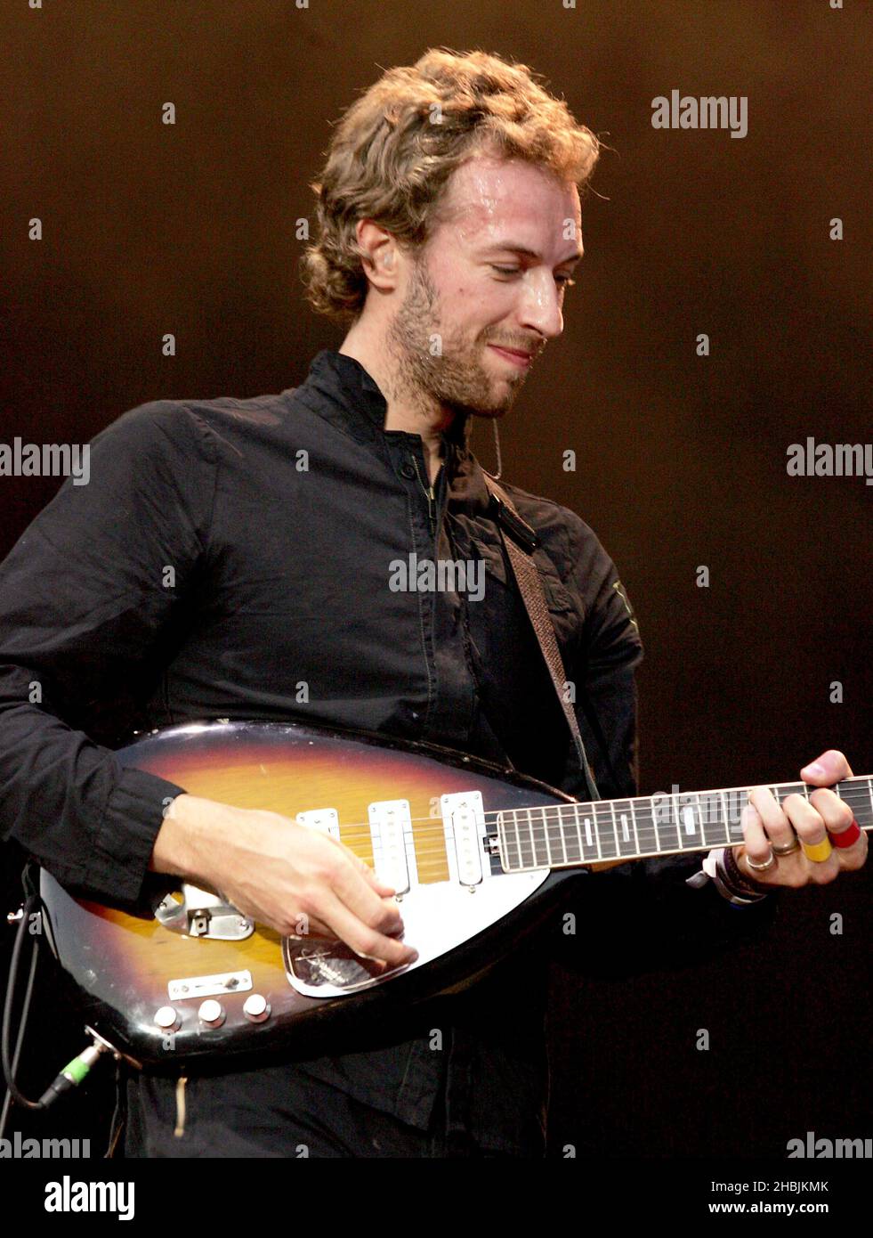 Chris Martin of Coldplay performs on stage as Coldplay perform on stage ...