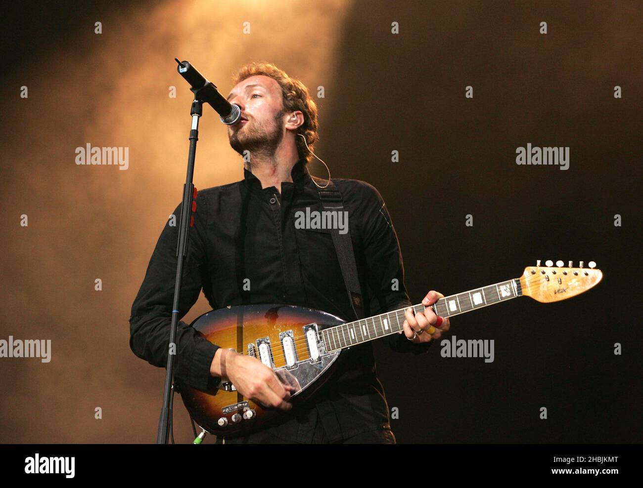 Chris Martin of Coldplay performs on stage as Coldplay perform on stage ...