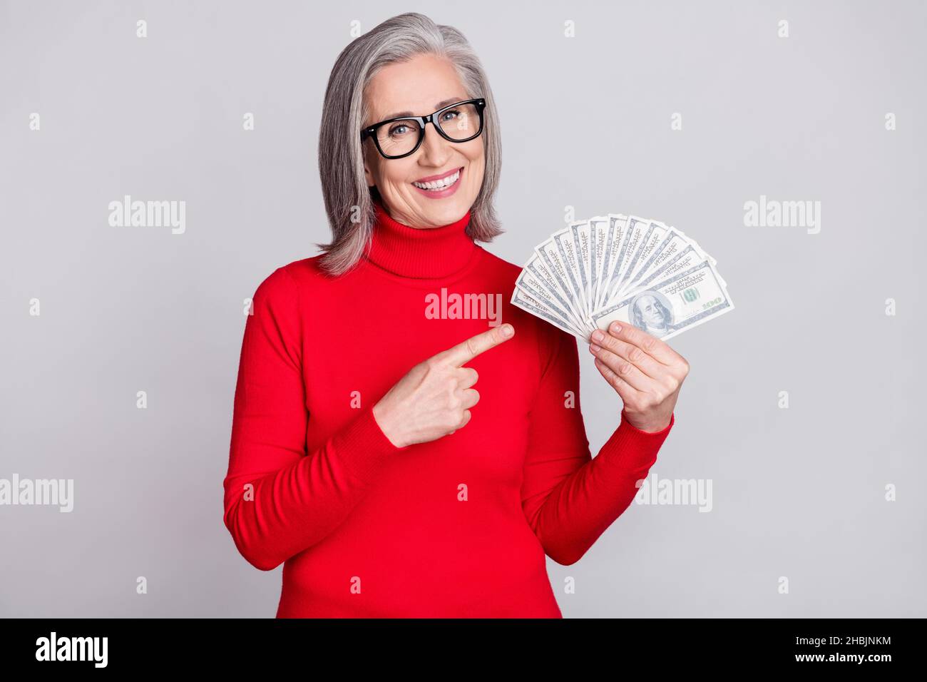 Photo of charming happy pretty nice old woman point finger money smile ...