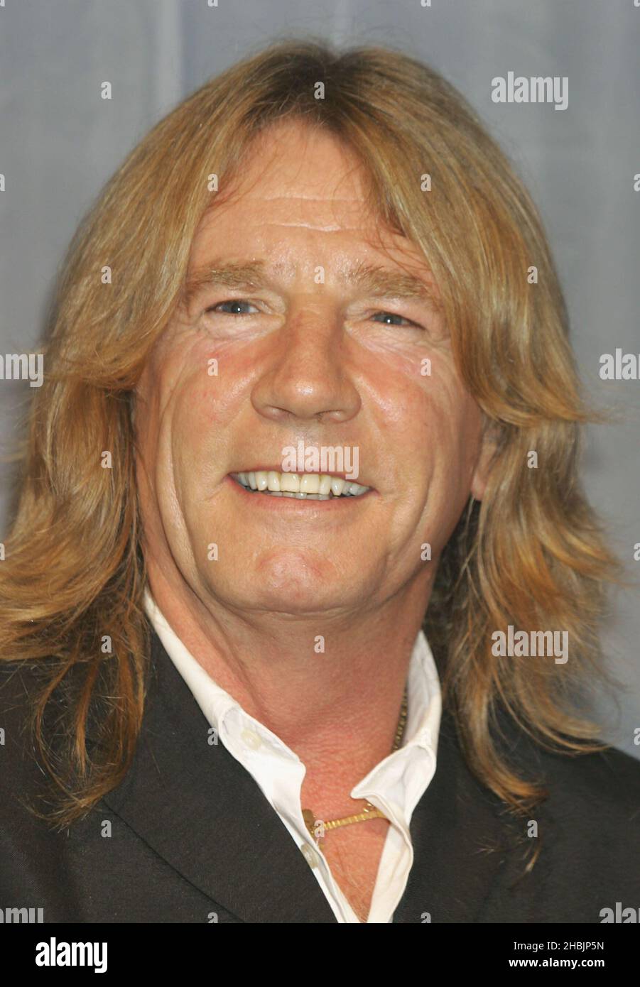 Rick Parfitt; of Status Quo w posing backstage at the DVD Launch party ...