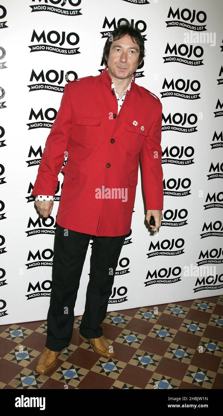 Steve Diggle of The Buzzcocks poses with The Mojo Inspiration Award ...